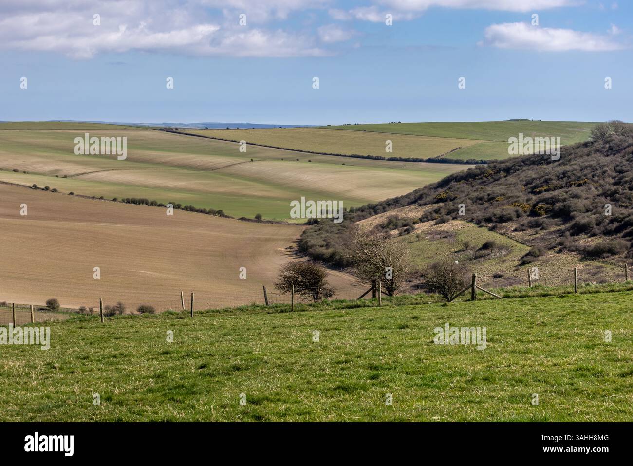 A view over hills in rural Sussex, with a blue sky overhead Stock Photo ...