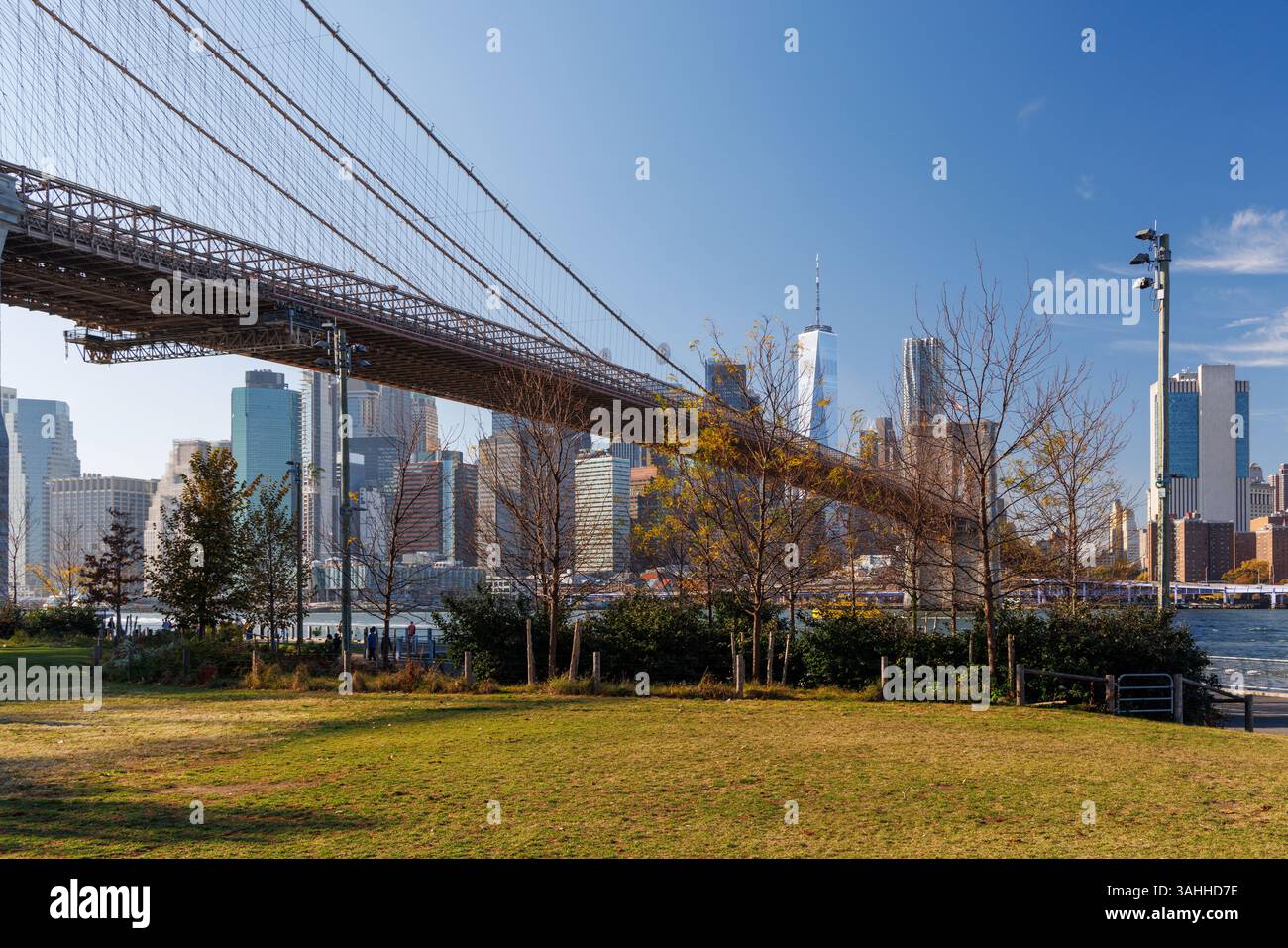 A stunning panoramic view of the iconic Brooklyn Bridge stretching gracefully towards Manhattan ...