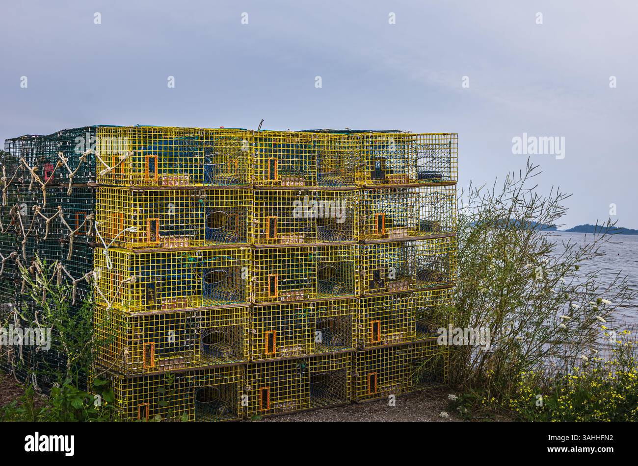 Stacks of metal lobster traps on a pier in Maine, Bailey Island, New ...