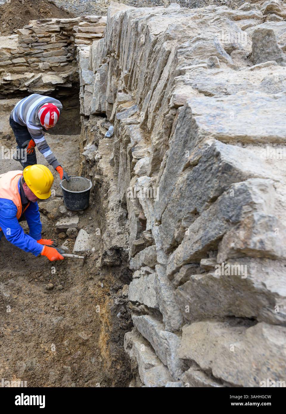 PRODUCTION - 08 April 2025, Saxony, Freiberg: Excavation workers from ...
