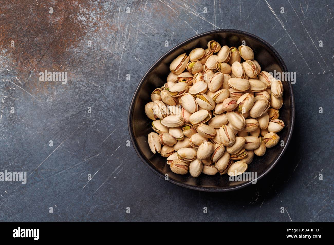 Fresh pistachios, showcasing their vibrant green color and unique ...