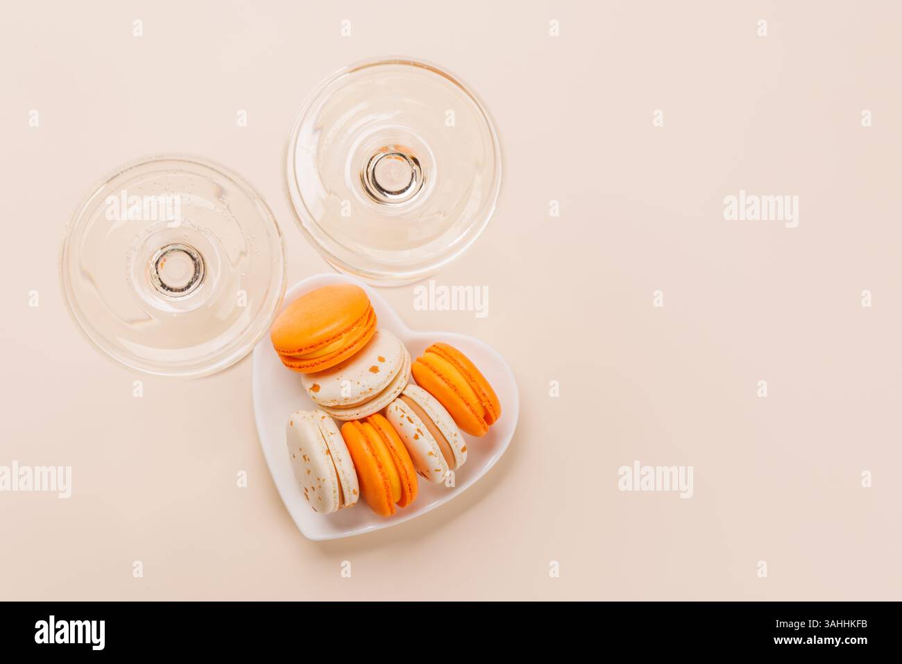 A luxurious pairing of champagne and delicate macaroons, creating an ...