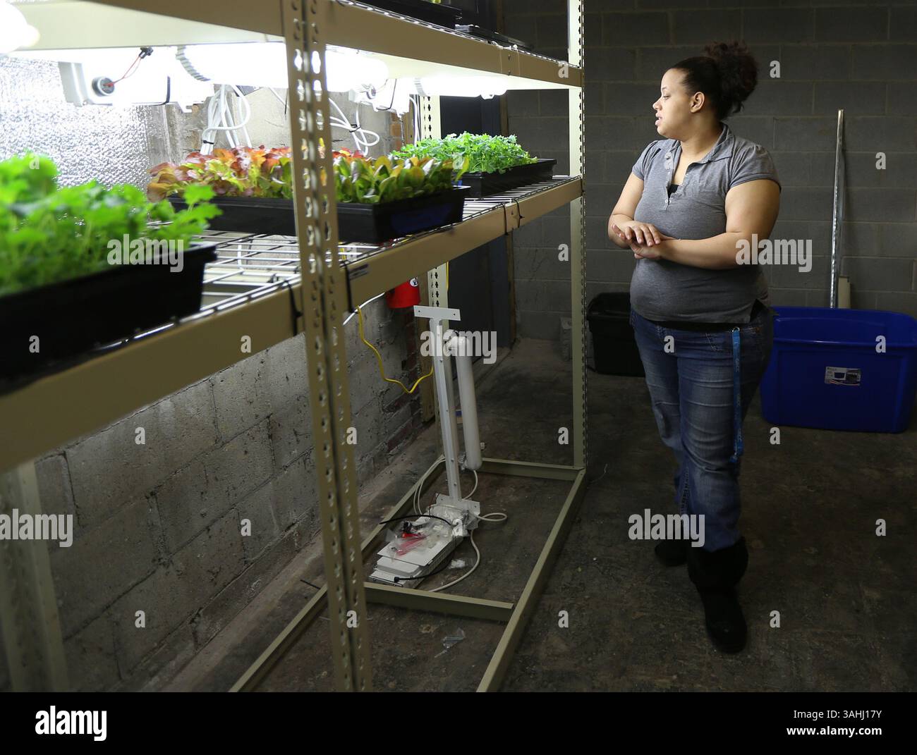 April 28, 2015 - MI, USA - Yvette Evans, 23, of Brightmoor, looks over ...