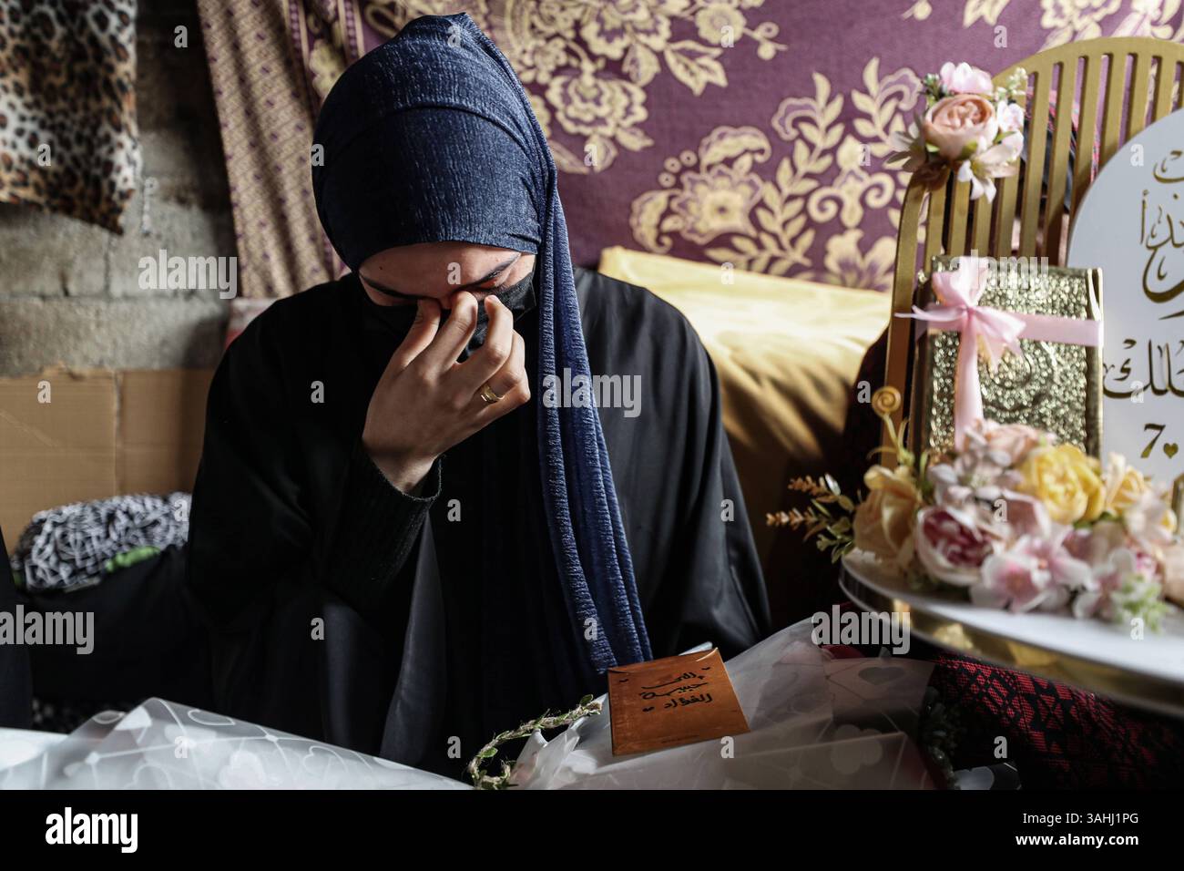 Palestinian girl Malak Abu Al-Omreen, 20 years old, is displaced with her family at Al-Dahyan ...