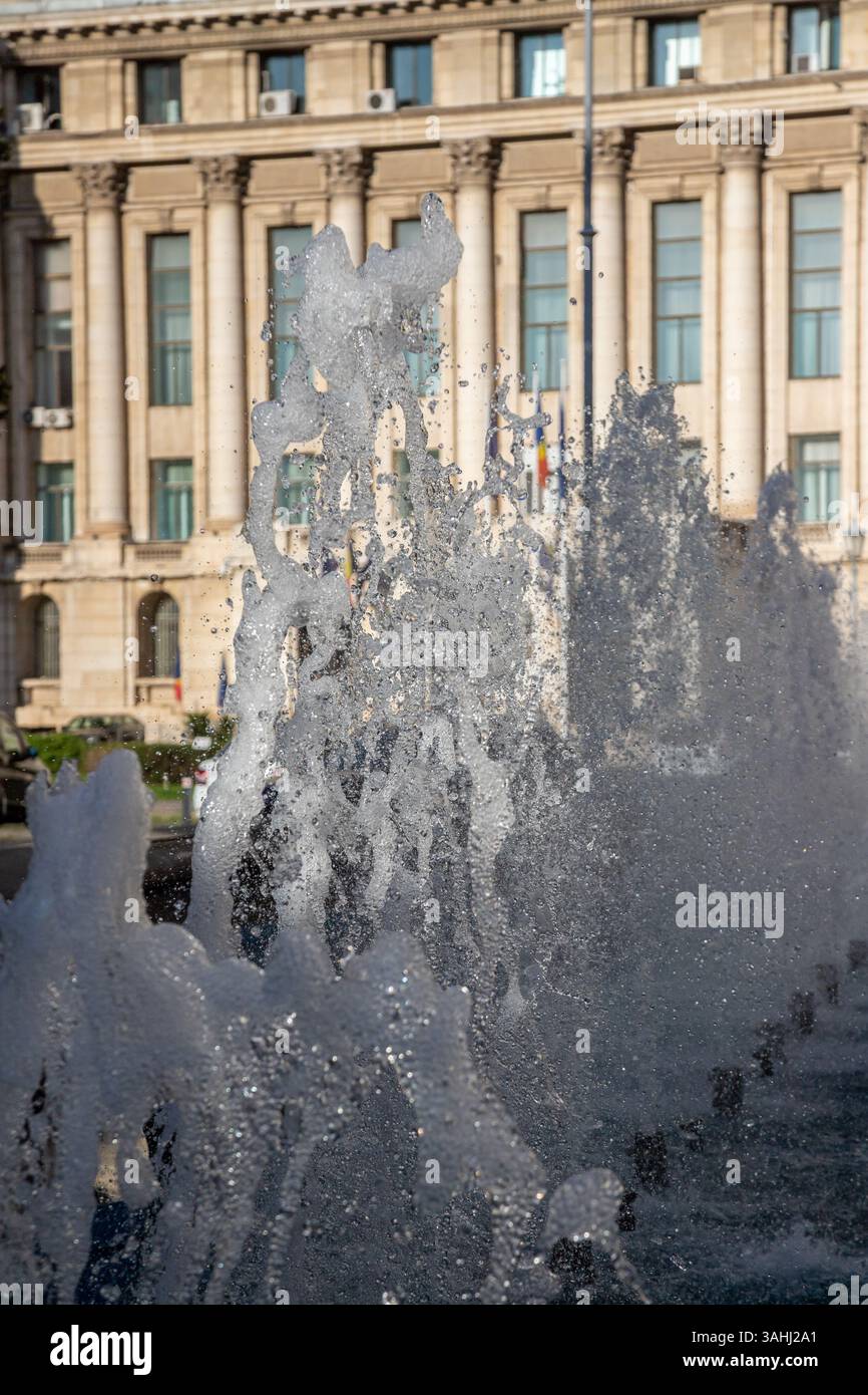 Water bursts from a fountain, creating a lively spectacle against the ...