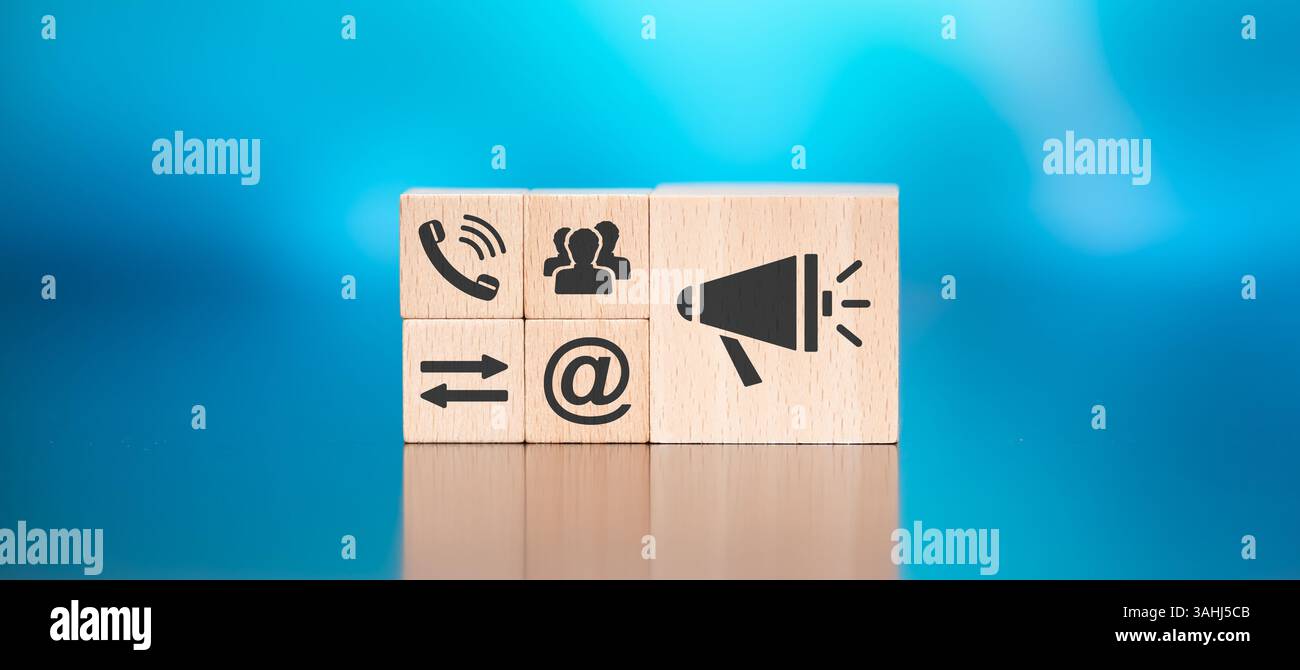 Wooden blocks with symbol of communication concept on blue background ...
