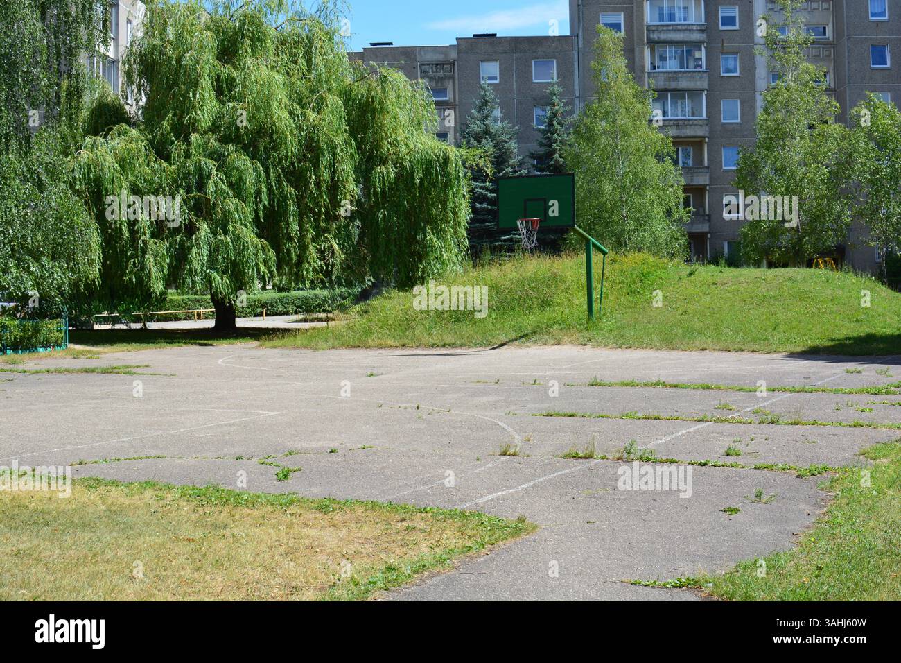 Children playground area near old soviet apartment houses in sunny ...