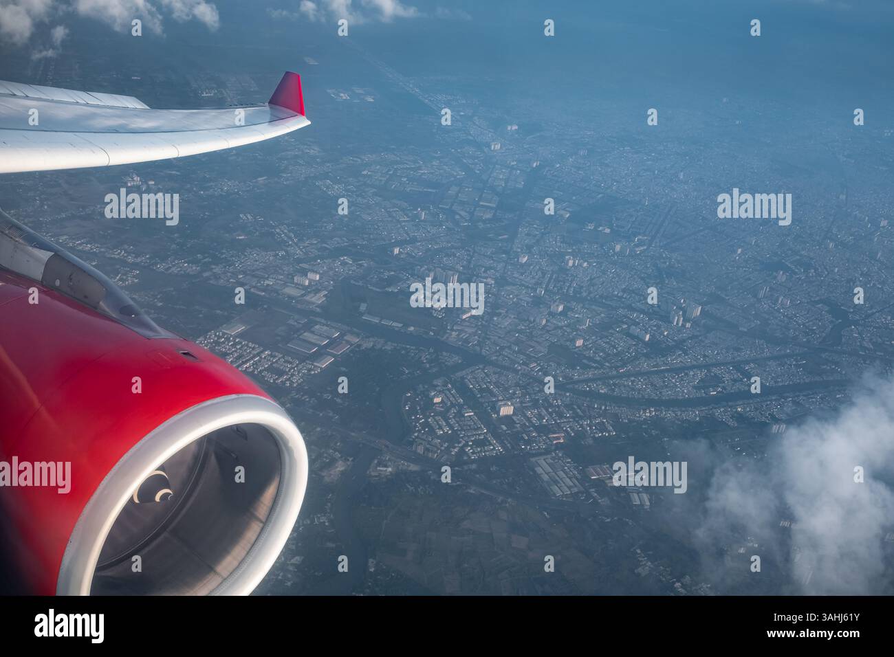 Photo from inside window airplane. View of an airplane wing and turbine ...