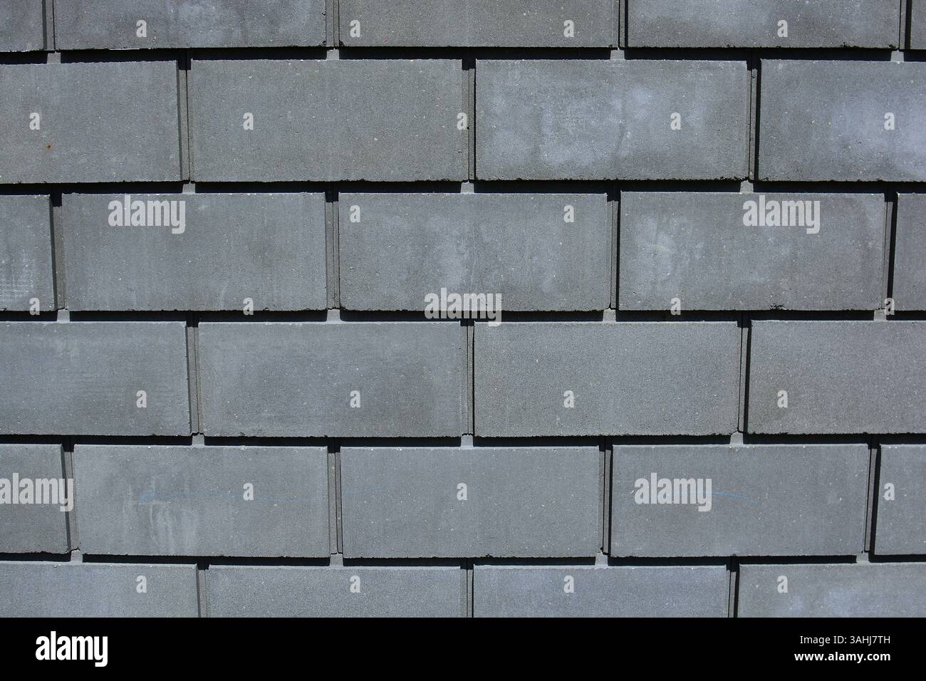 Wall background of dark grey bricks.Grey brick wall background. Dark ...