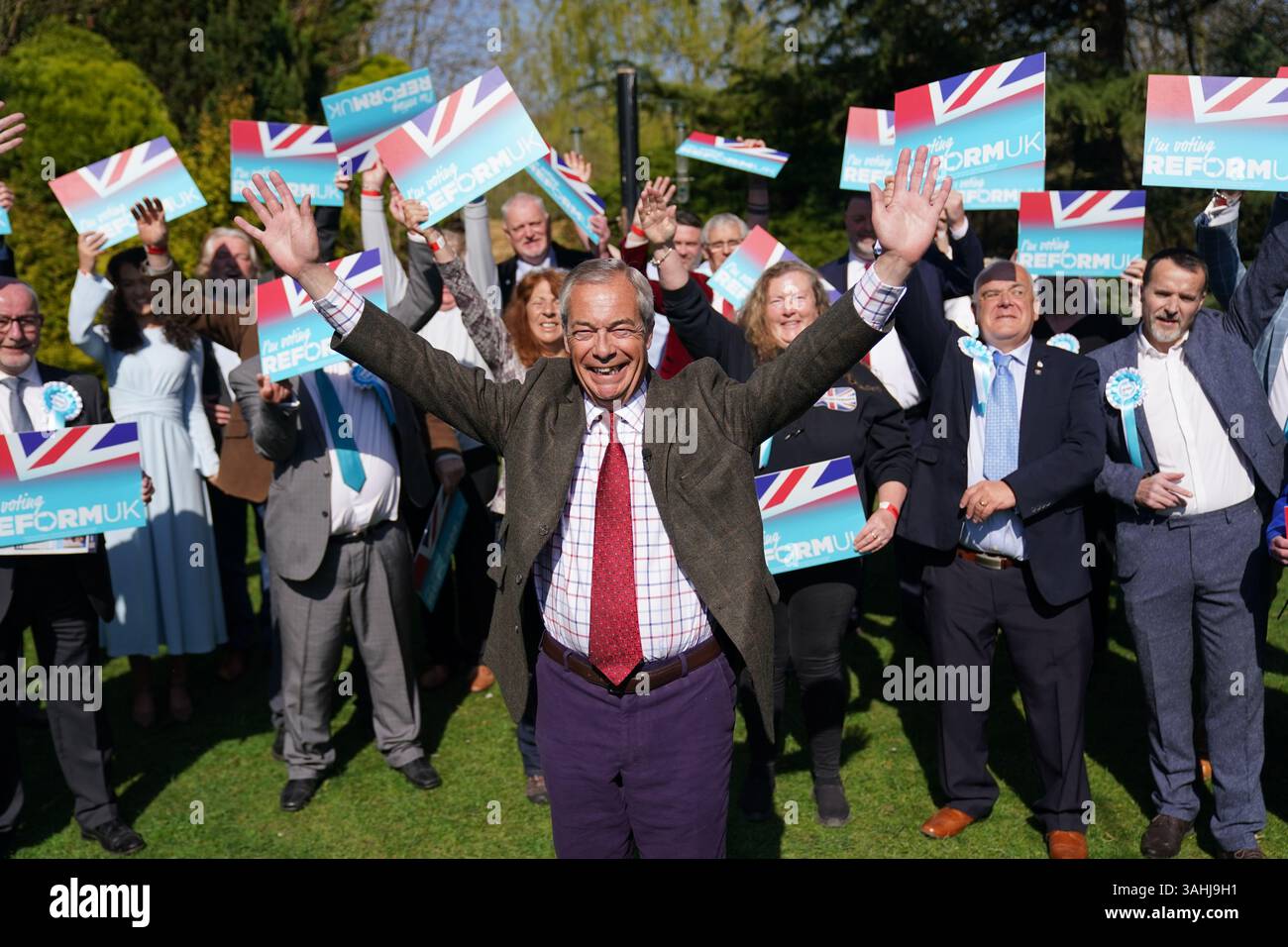 Reform UK leader Nigel Farage with his party's candidates at the Denby ...