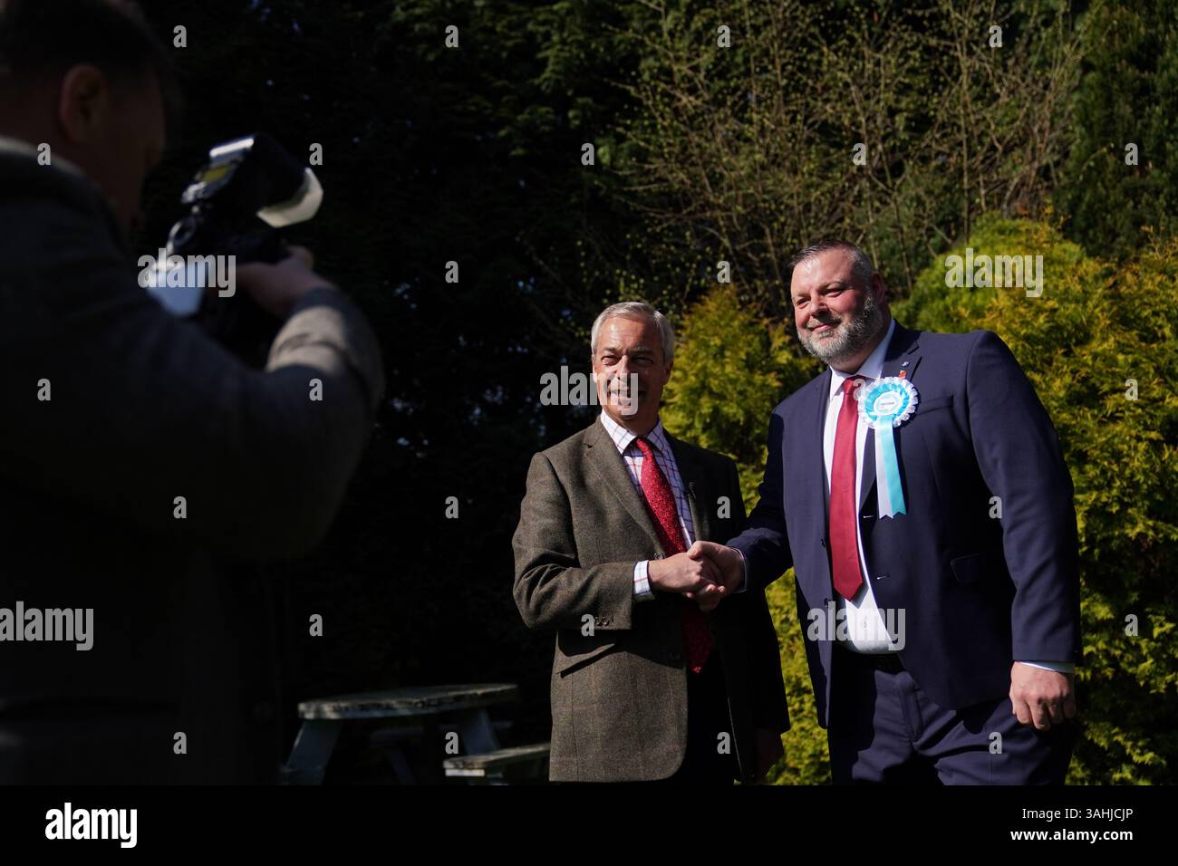Reform UK leader Nigel Farage having his photograph taken with his ...