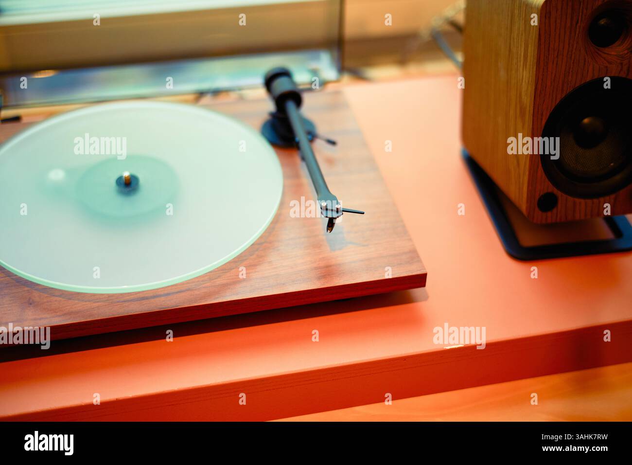 Vintage turntable and wooden speaker on an orange surface Stock Photo ...