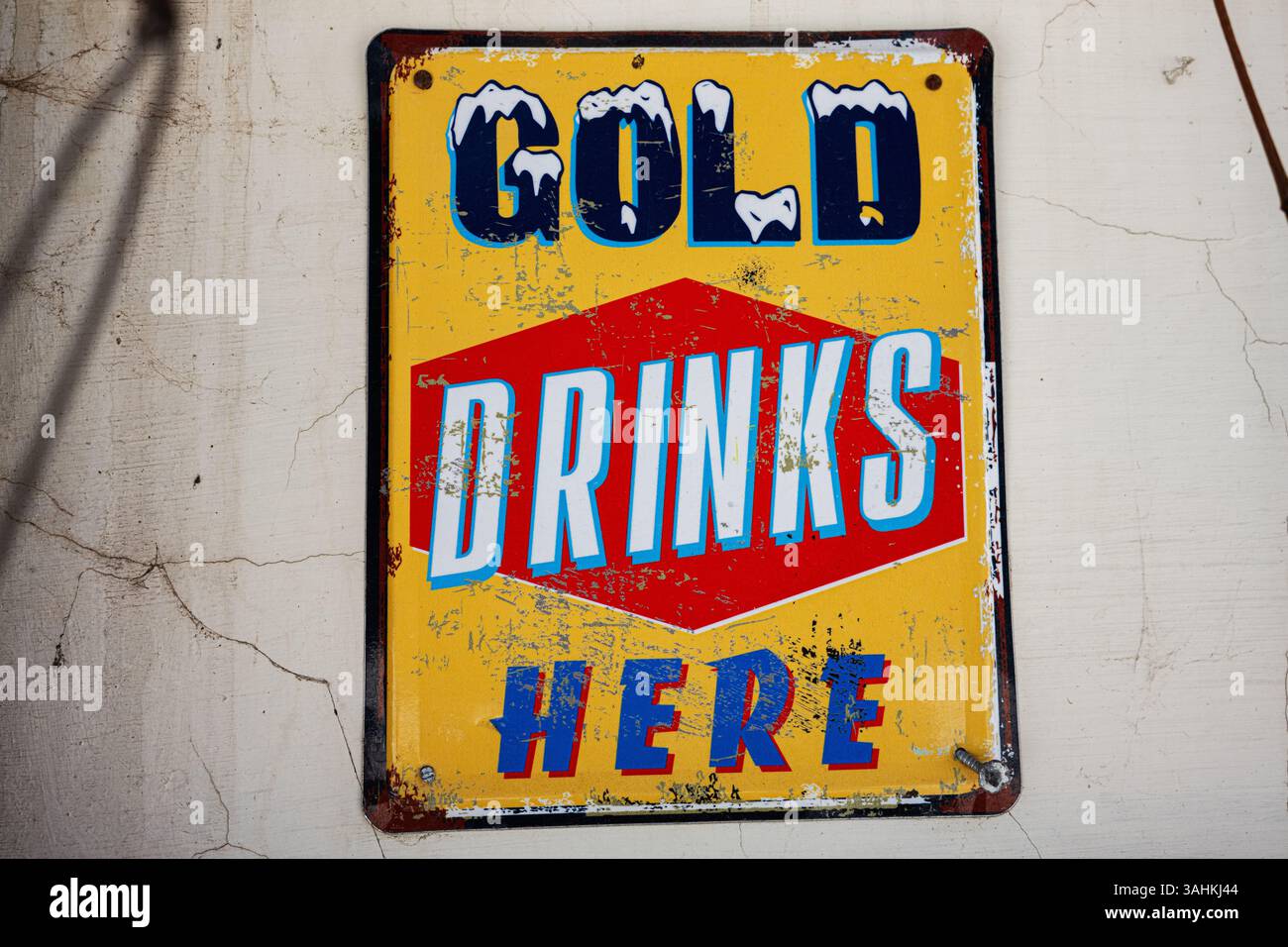 Rustic decorative metal sign advertising cold drinks, seen at a ...