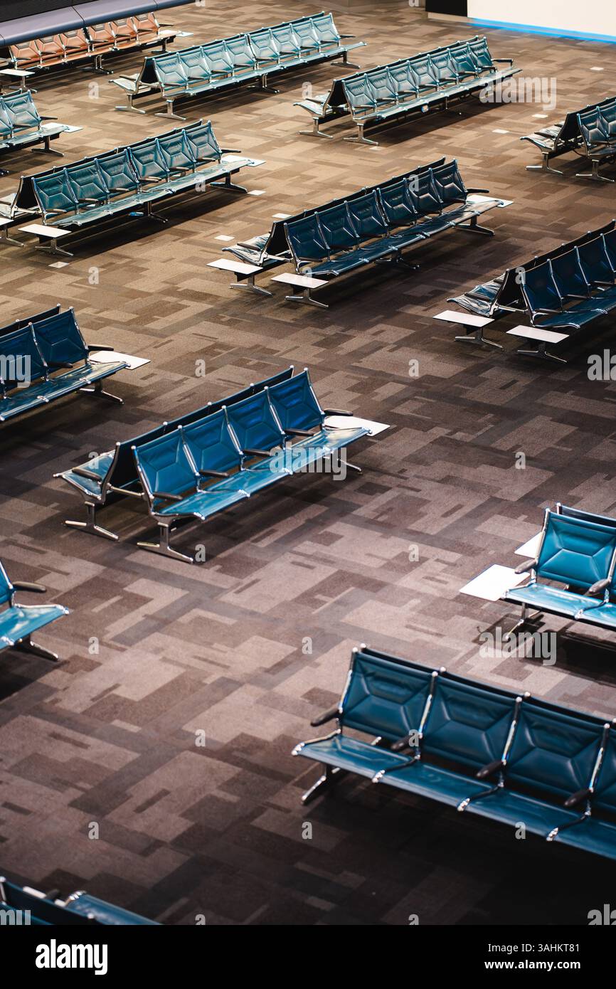 Modern Airport Waiting Area with Rows of Blue Seats, Spacious Terminal ...