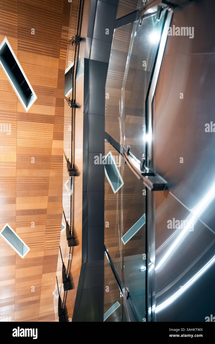 Sleek Modern Building Interior with Glass Railings and Wood Panels ...
