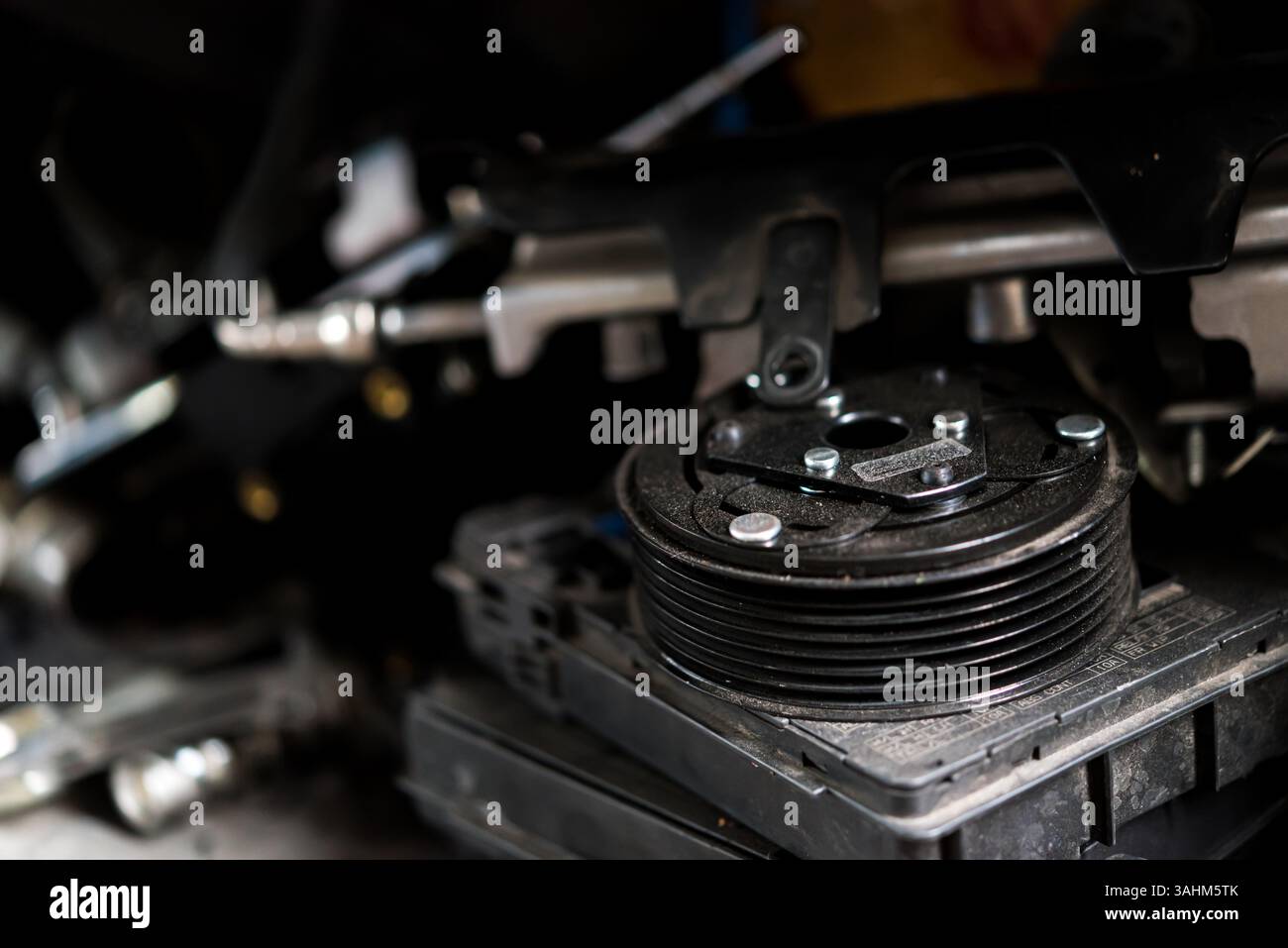 Disassembled car dirty engine close-up to engine parts and pulley at ...