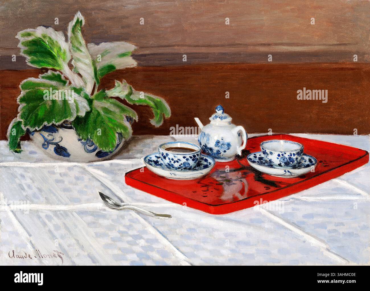 An exquisite tea set, beautifully arranged on a vibrant red tray, is ...