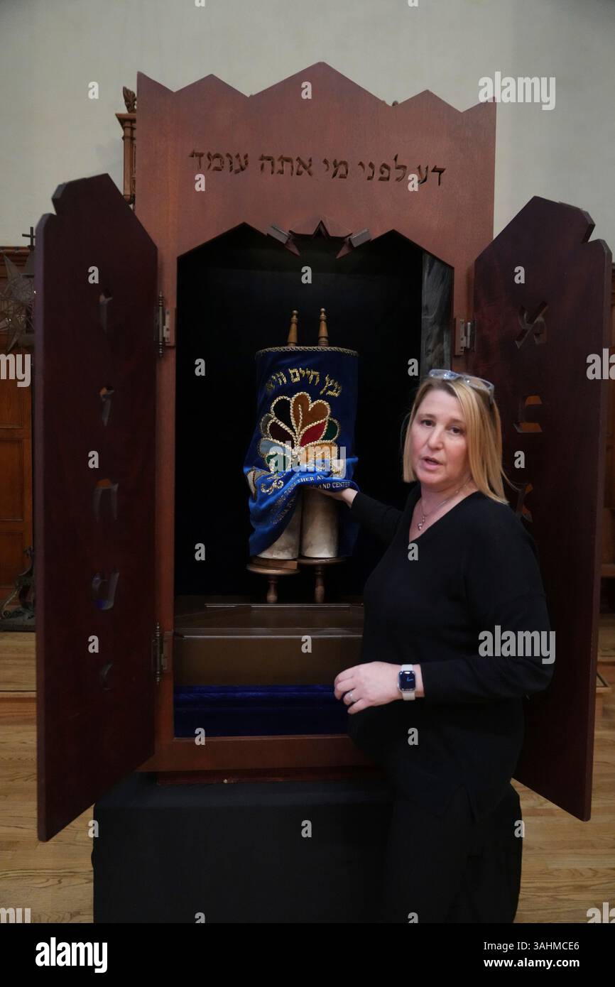 Cantor Ruth Berman Harris shows her temple's Torah scrolls from their ...