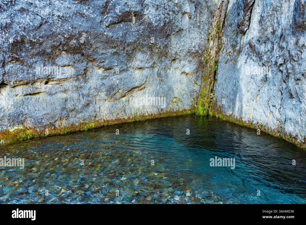 spring with drinking water in the mountains of kazakhstan. clean melt ...