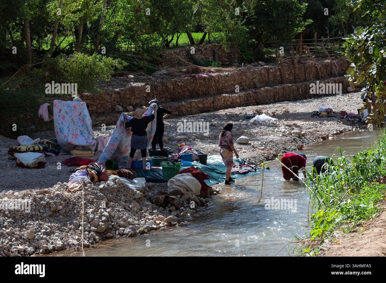 Women doing laundry in a river in Morocco Stock Photo - Alamy
