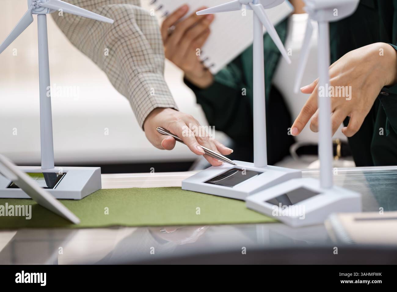 Sustainability and Business Collaboration. Professionals discussing ...