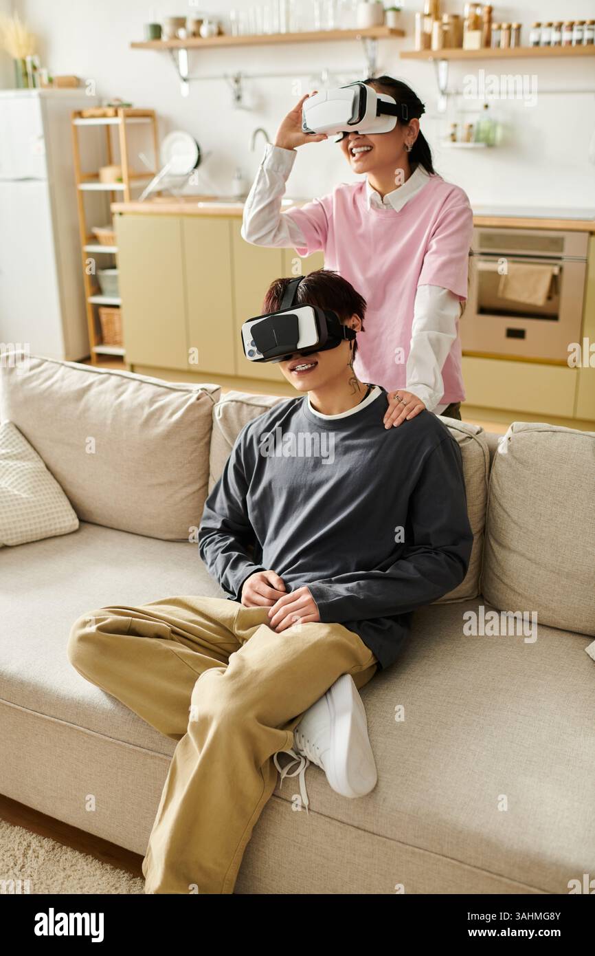 Couple immersed in virtual hi-res stock photography and images - Alamy
