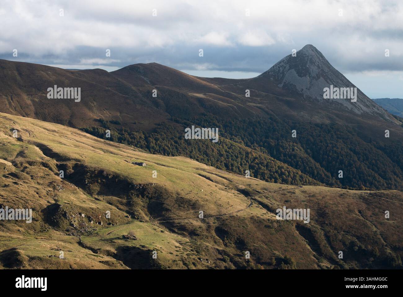 The Lonely Hut and the Pyramidal Peak of Cantal Stock Photo - Alamy