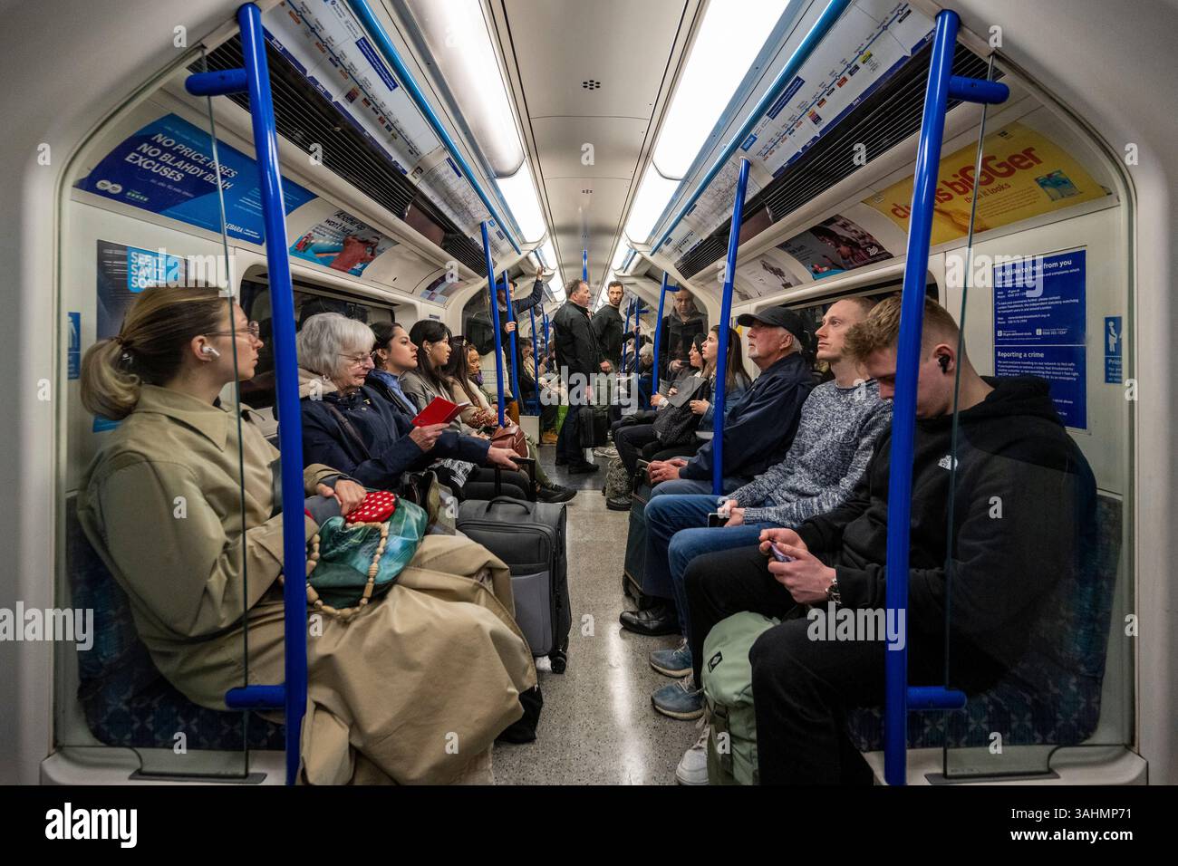 London, UK. 10 April 2025. Tube passengers ride the Victoria Line on ...