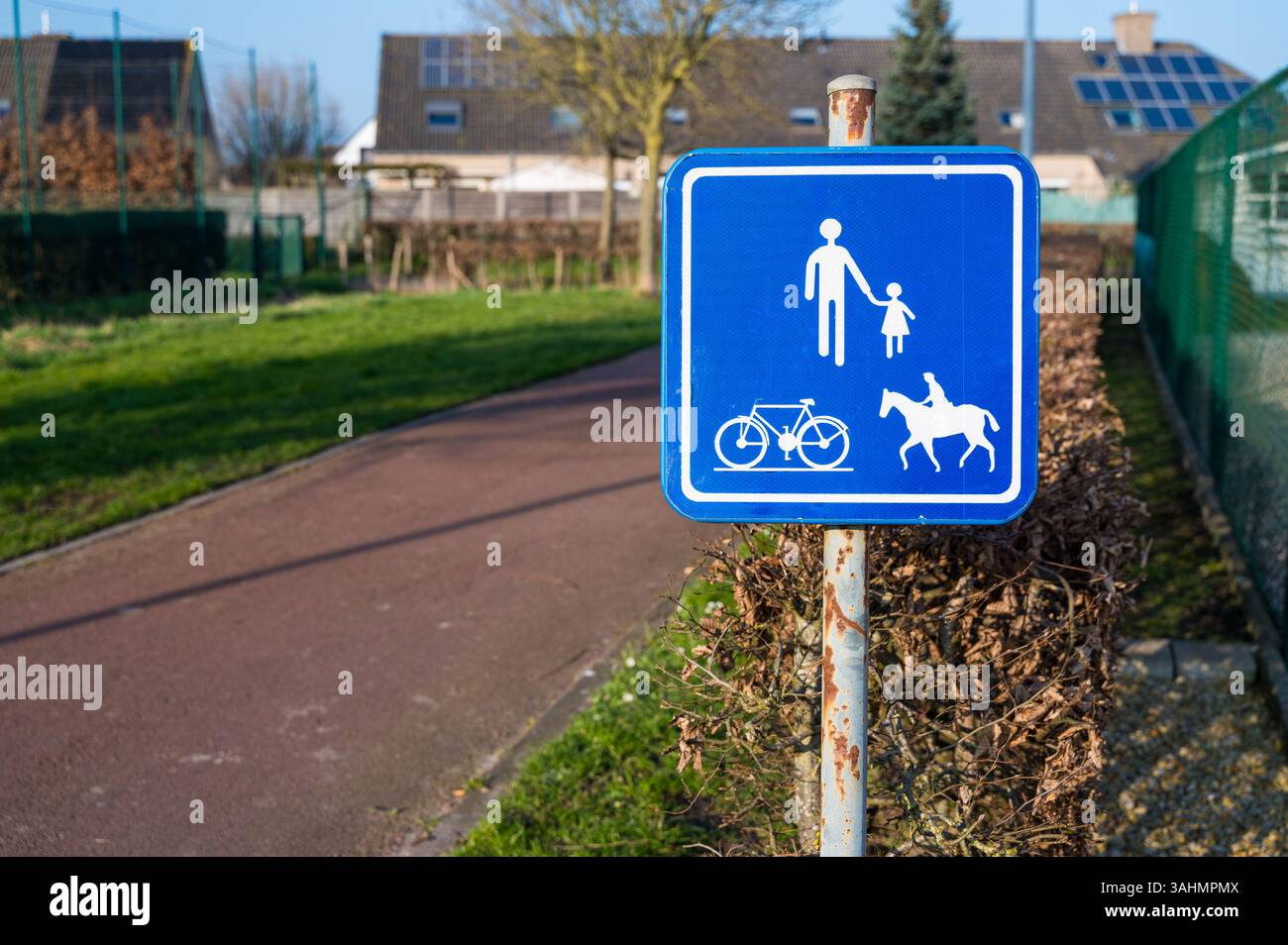 A blue sign indicates a shared path for pedestrians, cyclists, and ...