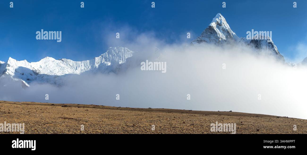 Mount Ama Dablam within cloud and blue sky, way to Mt Everest base camp ...