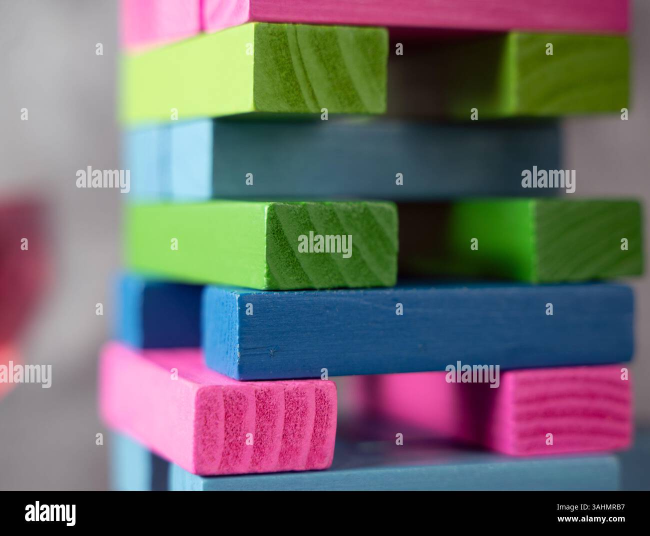 Colorful wooden blocks stacked creatively, ideal for childrens playtime ...