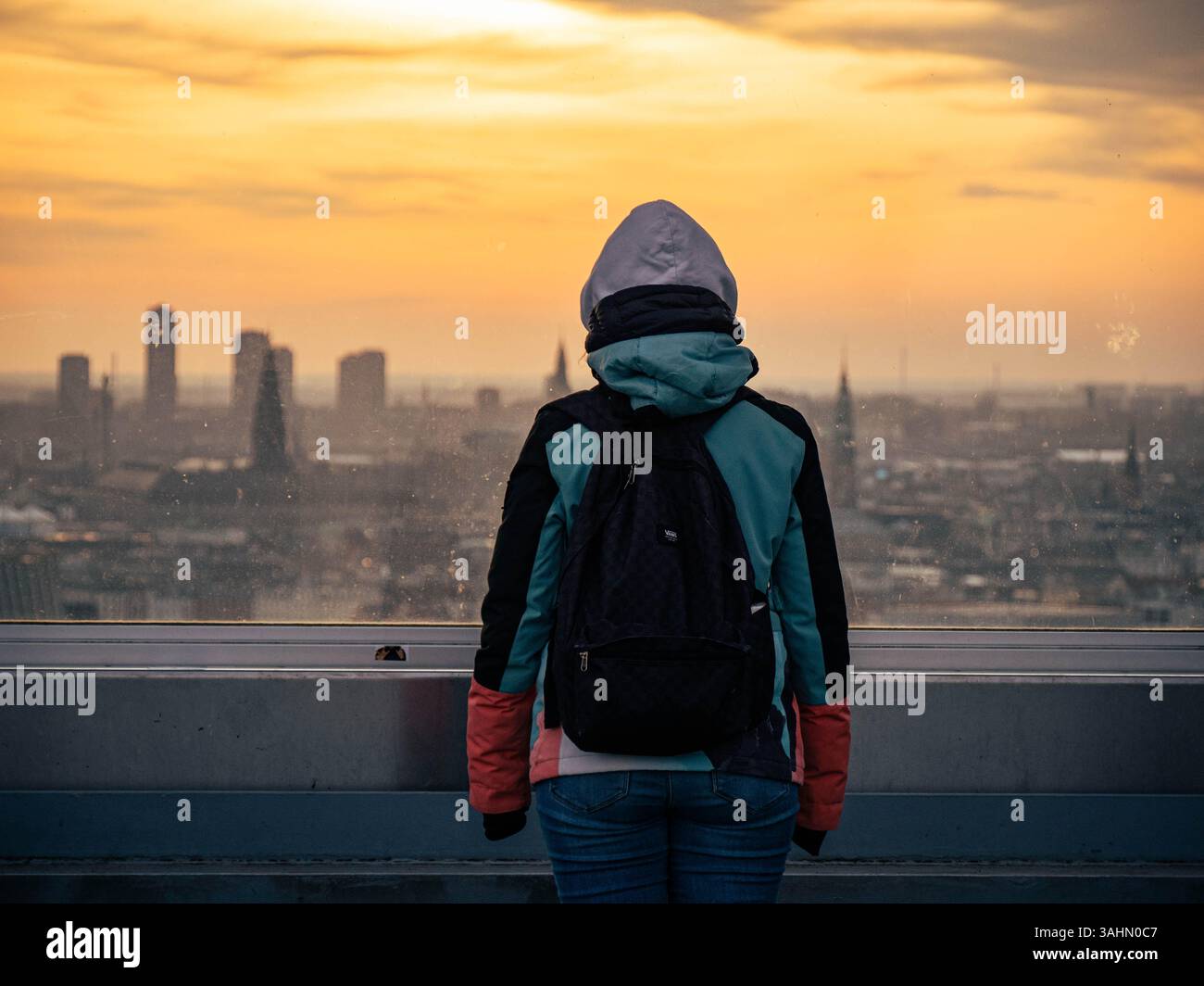 An elevated sunset view over Copenhagen with golden light bathing the ...