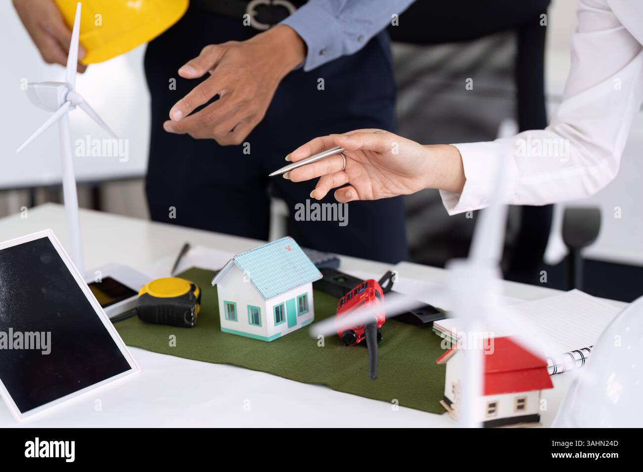 Sustainable Engineering Practices. Engineers collaborating on green ...