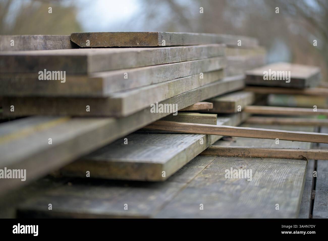 Stacked wooden planks prepared for carpentry or construction work ...