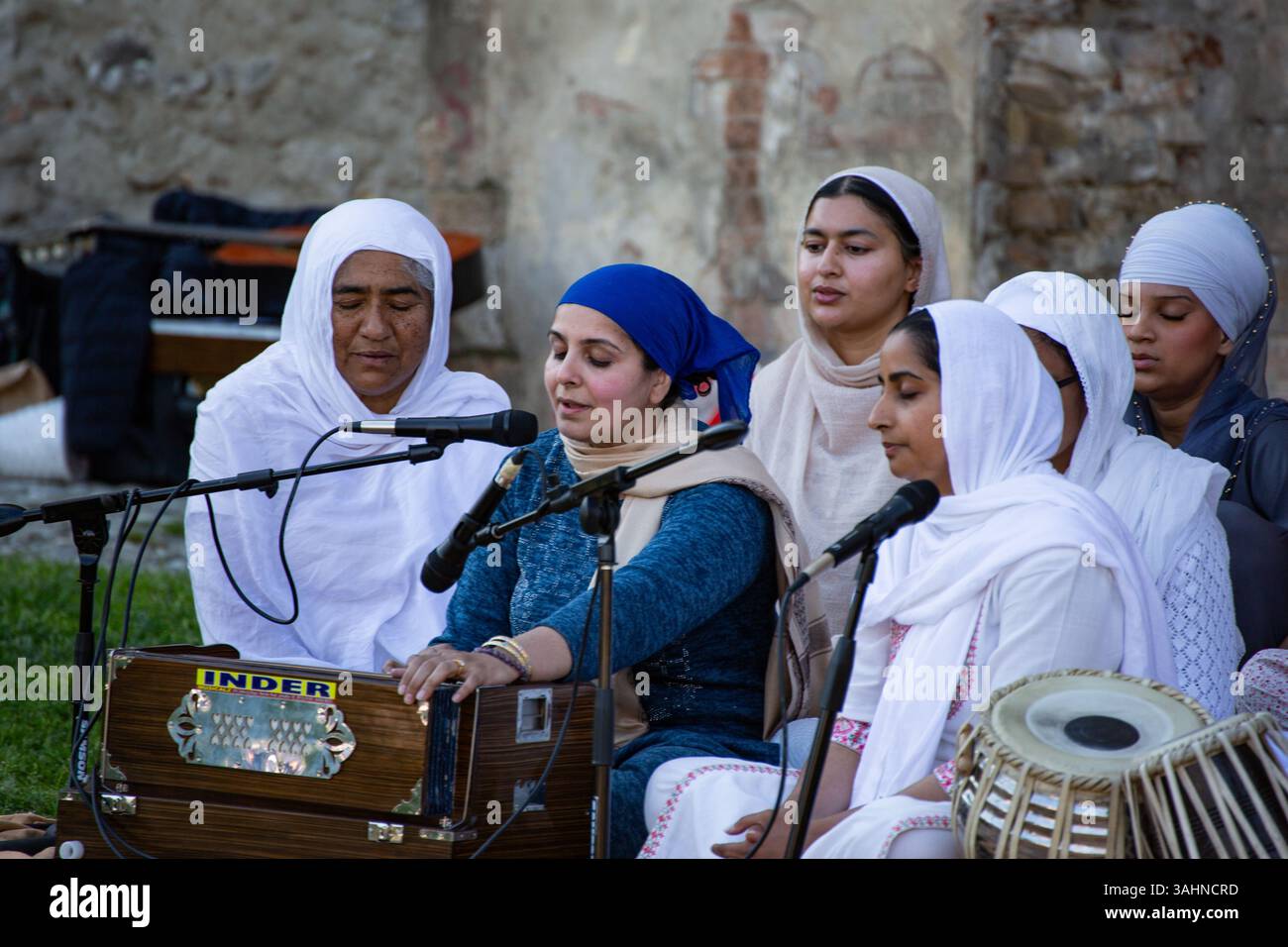 Cultural women’s group performing Arabic songs using harmonium and ...