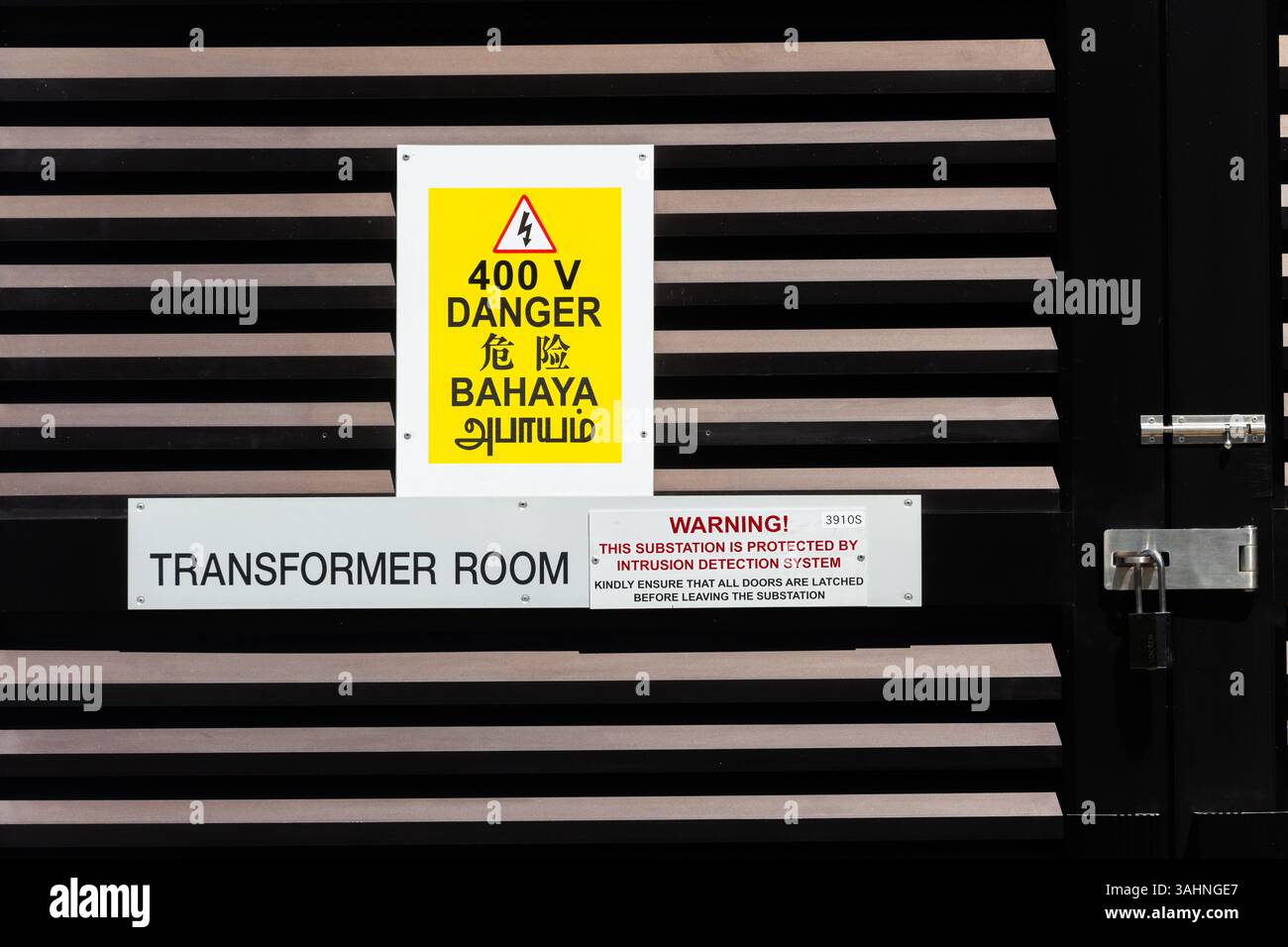 Locked up transformer room doors, yellow warning sign, 400 electrical ...