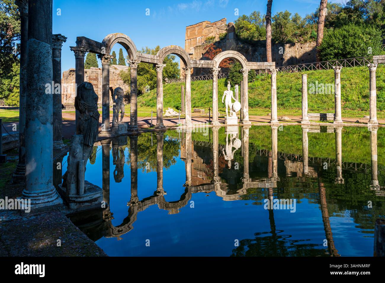 Roman ruins used as decoration for a pond in a italian garden Stock ...