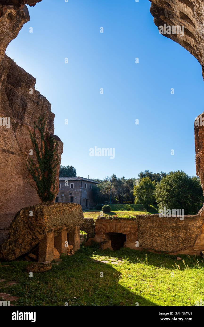 Rural italian house viewed through ancient roman ruins in Hadrian Villa ...