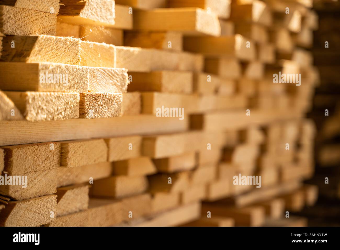 Close up stacks with wooden planks in sawmill storage warehouse. Stack ...