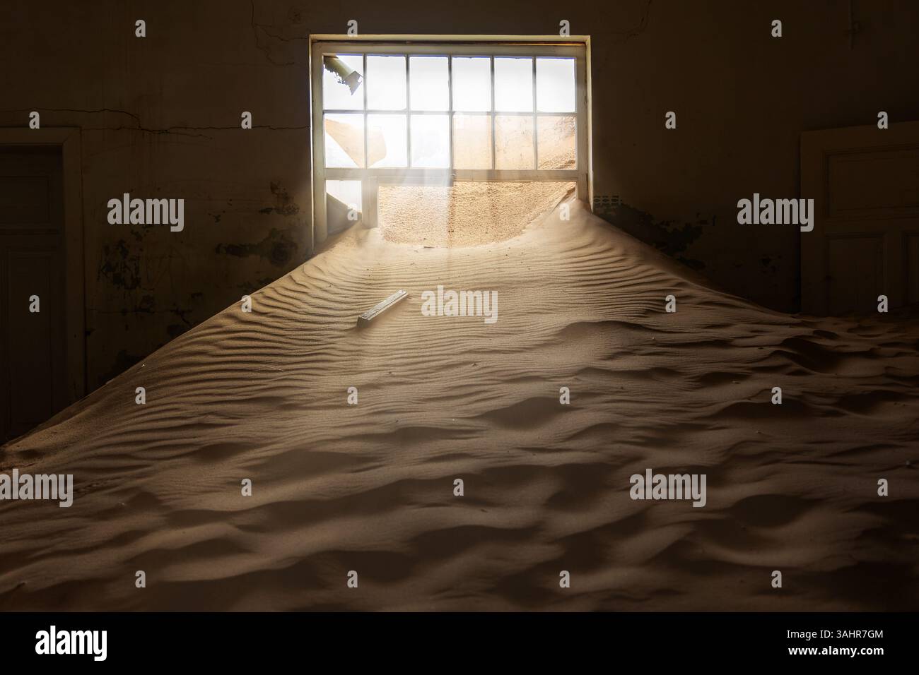 The abandoned house buried by sand in Kolmanskop deserted diamond mine ...