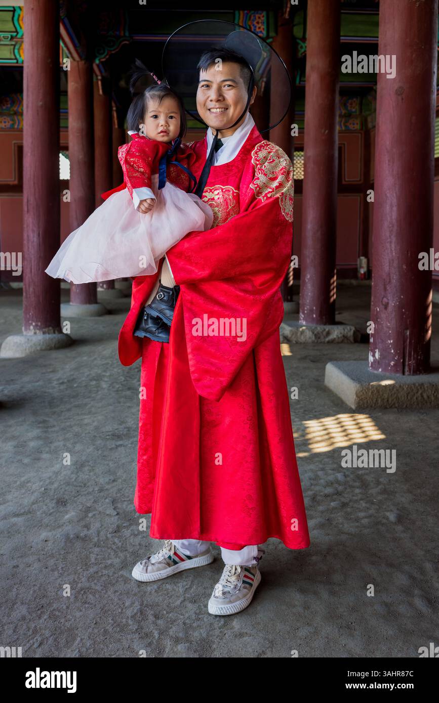 A father and child dressed in traditional Korean Hanbok dress ...