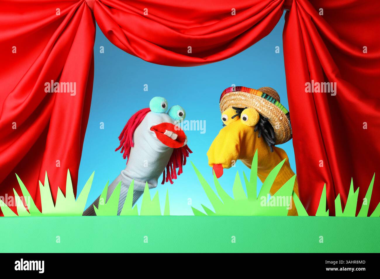 Creative puppet show on stage with decorations and red curtains Stock ...