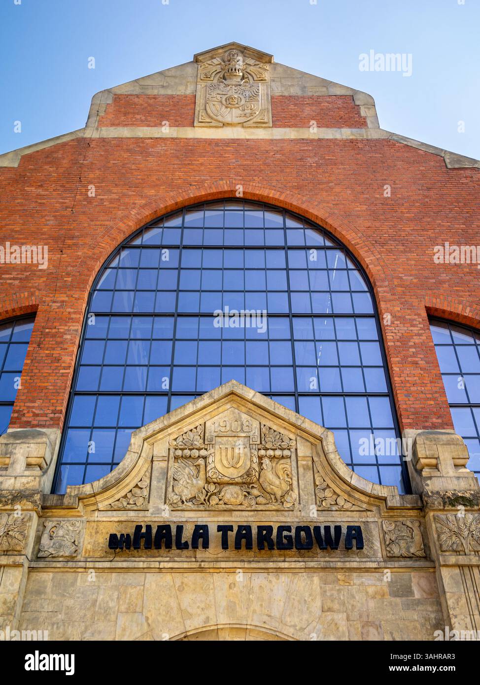 A distinctive brick building prominently displaying the words hala ...