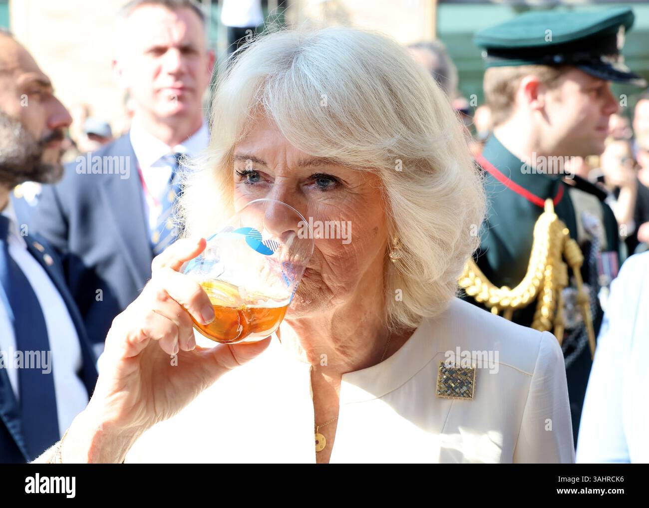 Queen Camilla tastes a drink during a visit to a UK-Emilia Romagna Food ...