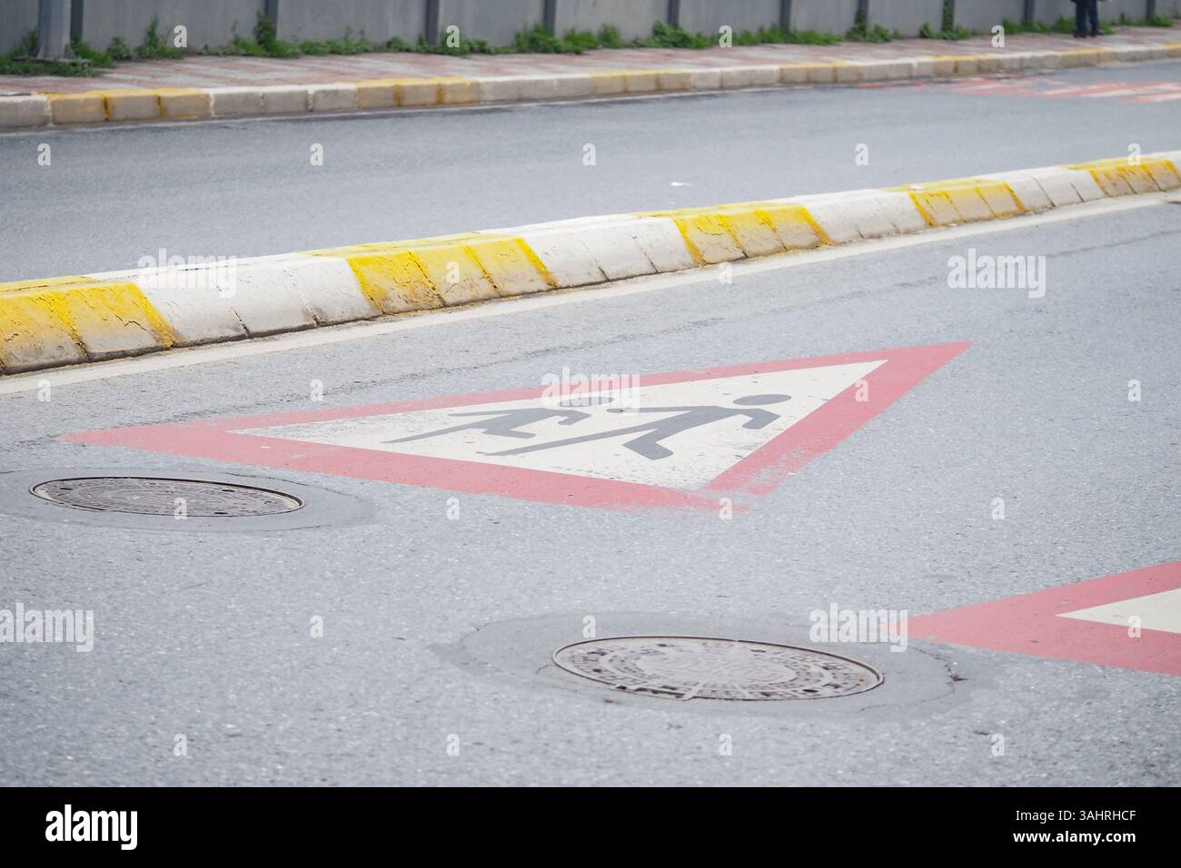 Road sign indicating pedestrian crossing near busy street Stock Photo ...