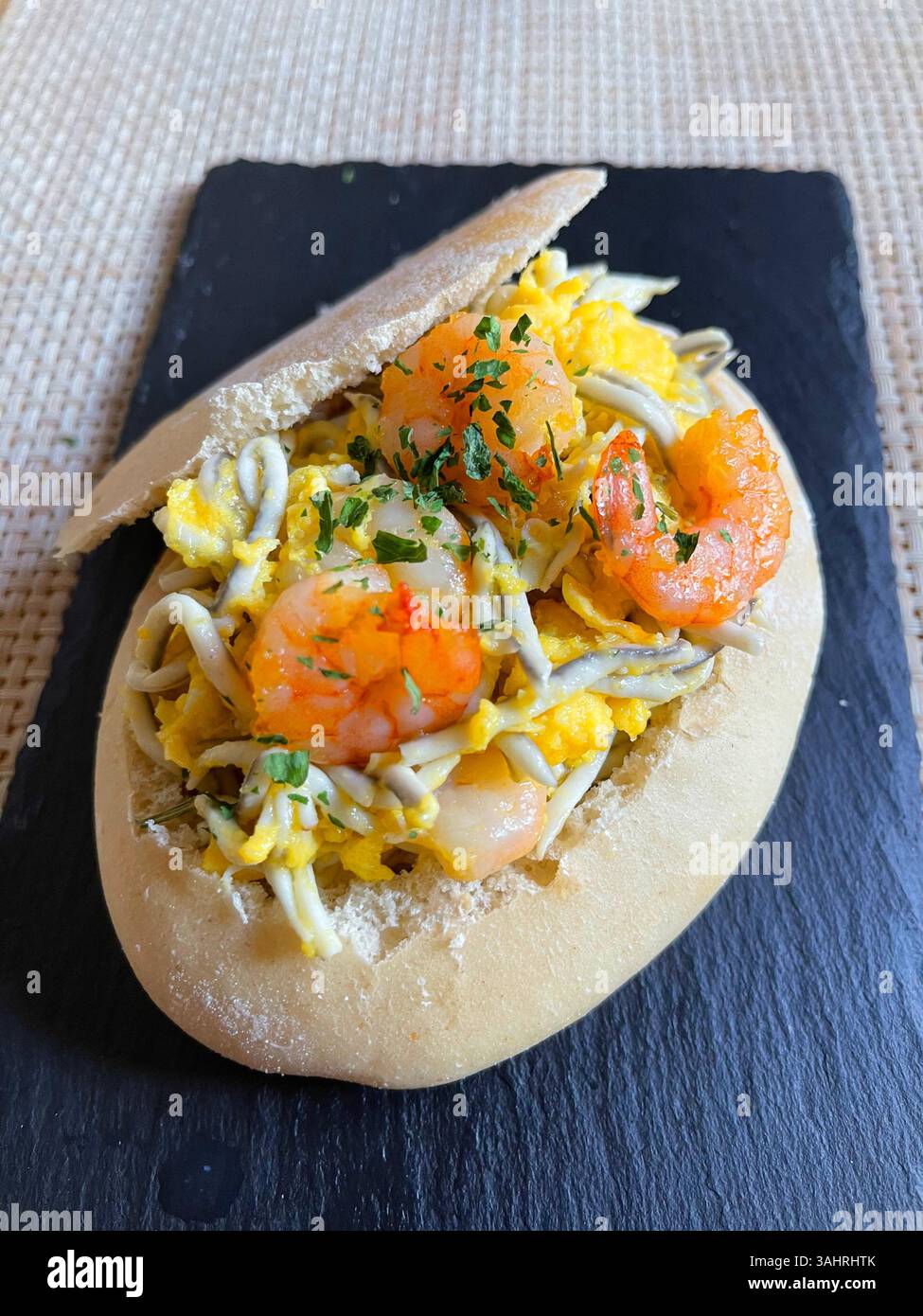 Tapa made of gulas, prawns and eggs in bread. Spain Stock Photo - Alamy