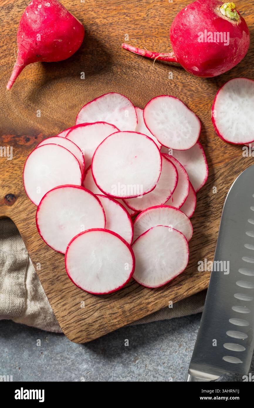 Organic Red Cut Radish Slices on a Cutting Board Stock Photo - Alamy