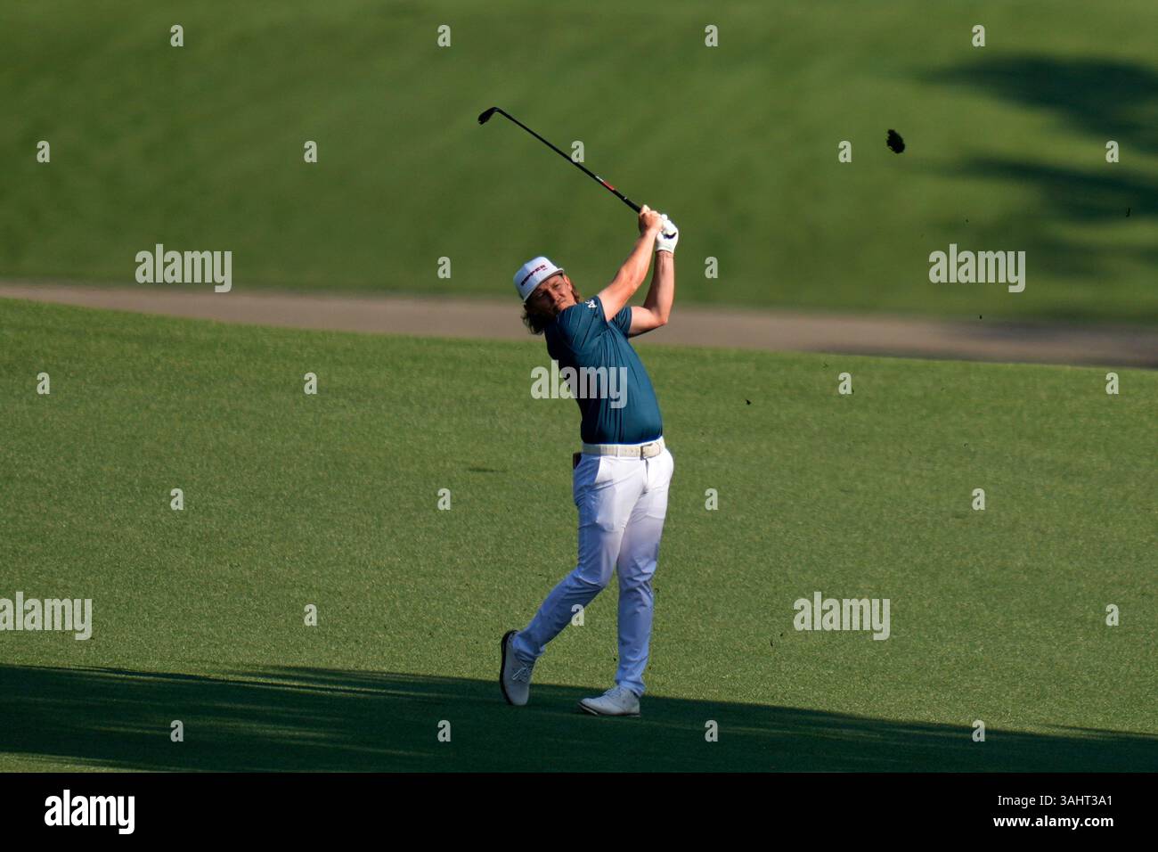 Cameron Smith, of Australia, hits from the fairway on the fifth hole ...