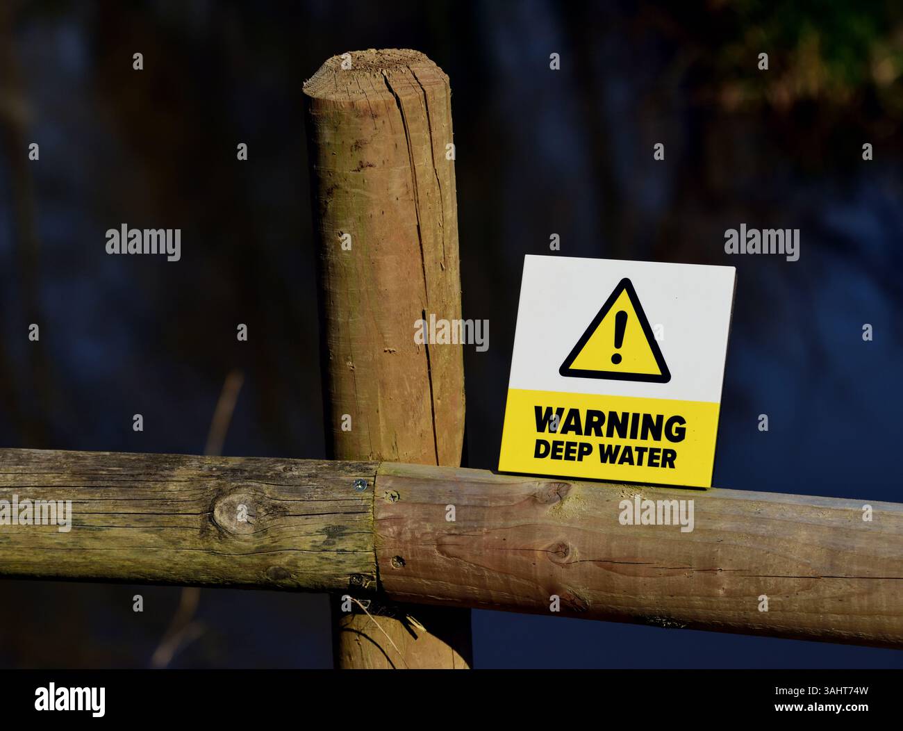 A warning sign beside a pond at Paignton zoo Stock Photo - Alamy