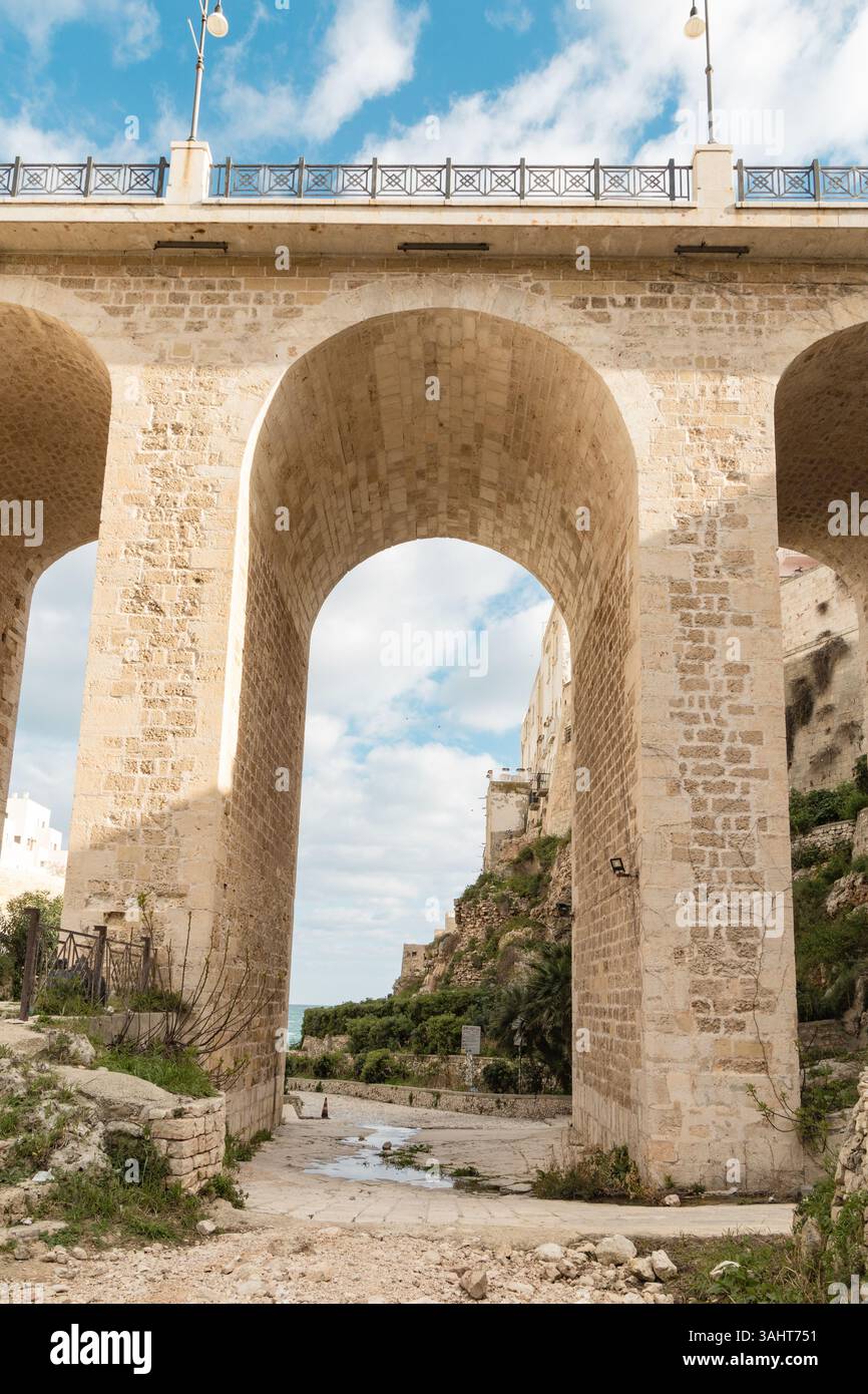 The iconic bridge above Lama Monachile beach in Polignano a Mare ...